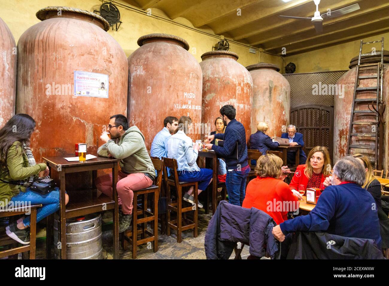 Earthenware wine vats inside Casa Morales restaurant, Seville ...