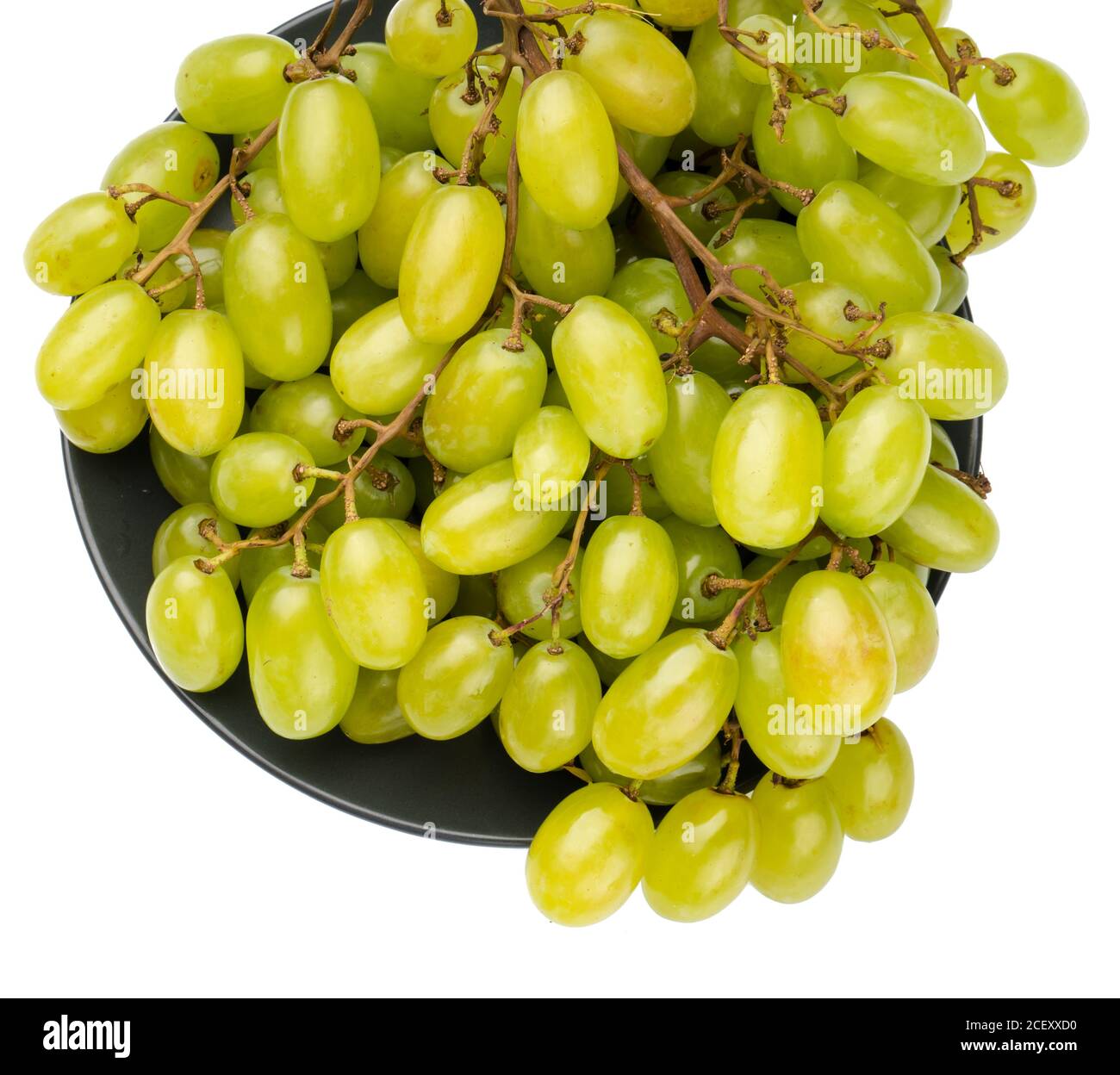 A bunch of table grapes in a plate on a white background isolated Stock ...