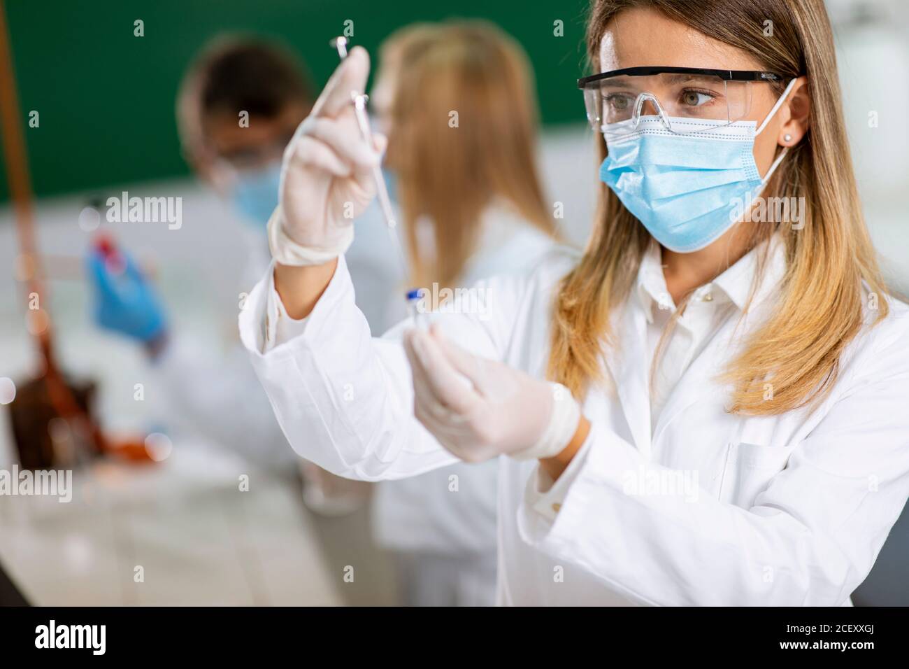 Doctor wearing lab coat hi-res stock photography and images - Alamy