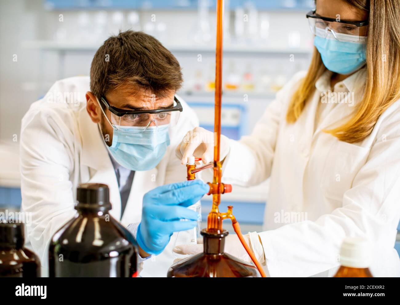 Young researchers analyzing chemical data in the laboratory Stock Photo ...