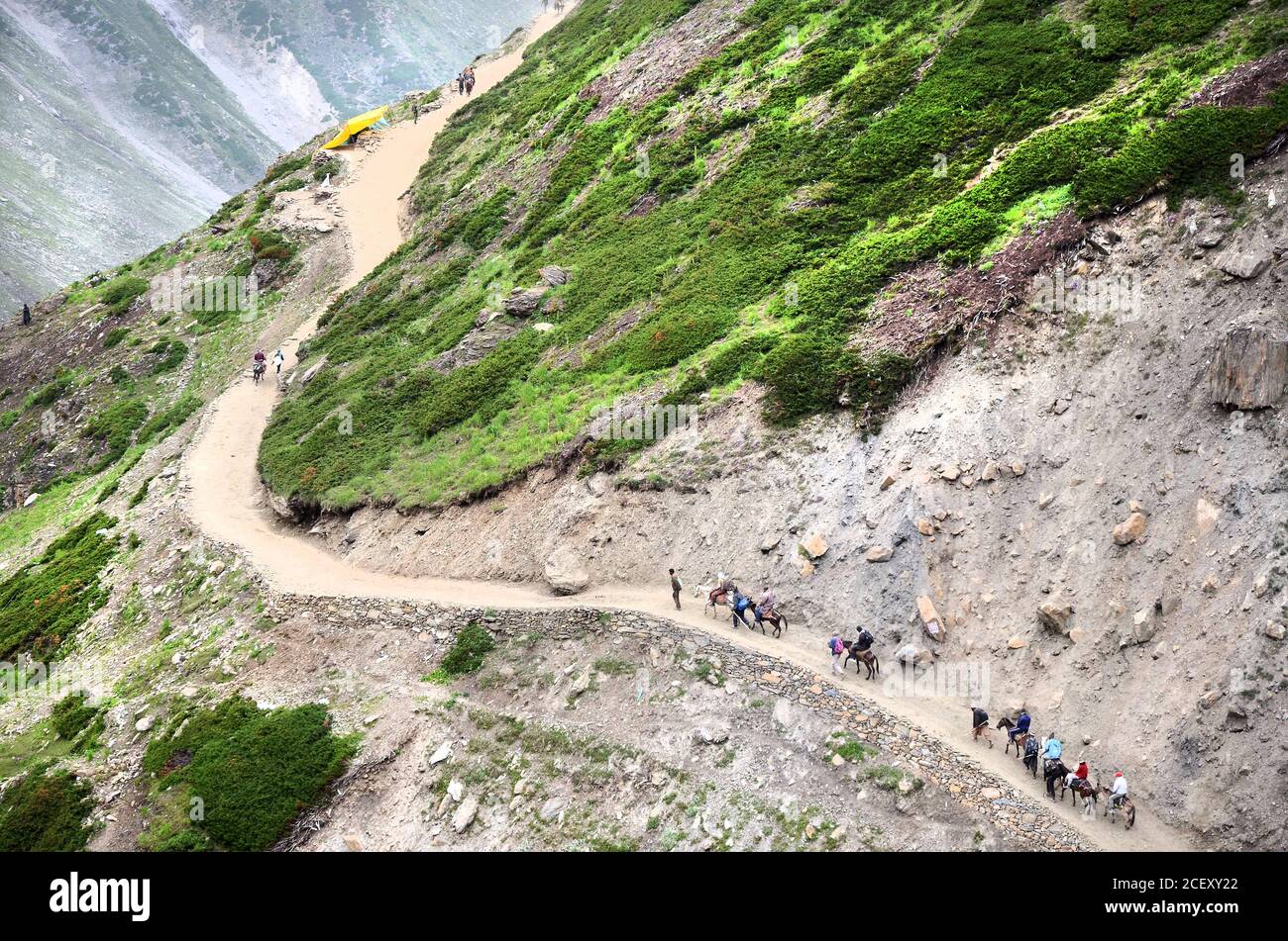 Hindu devotees visit during their pilgrimage from Baltal Base Camp to ...