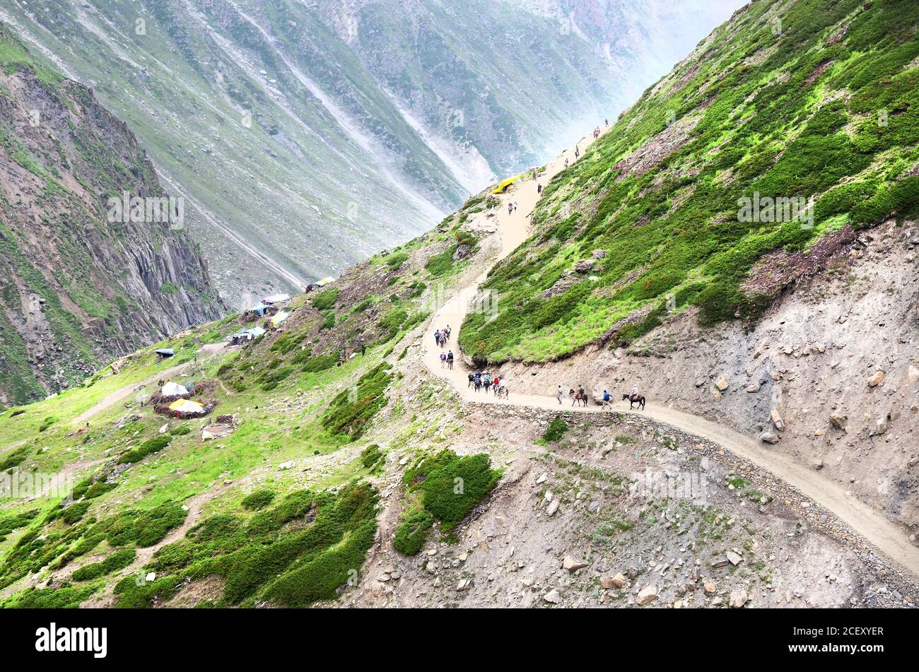 Hindu devotees visit during their pilgrimage from Baltal Base Camp to ...