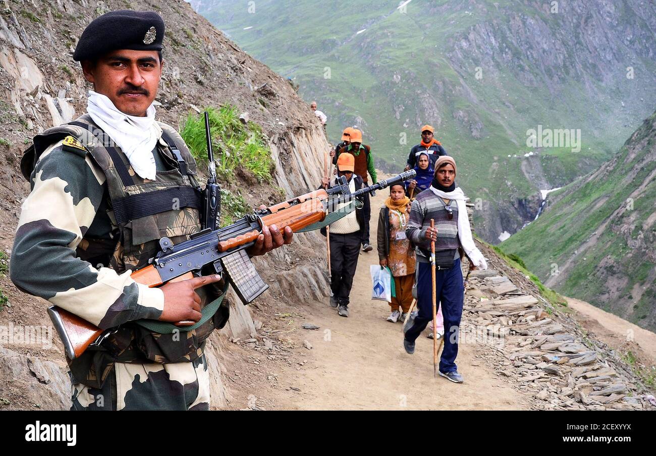 Hindu devotees visit during their pilgrimage from Baltal Base Camp to ...