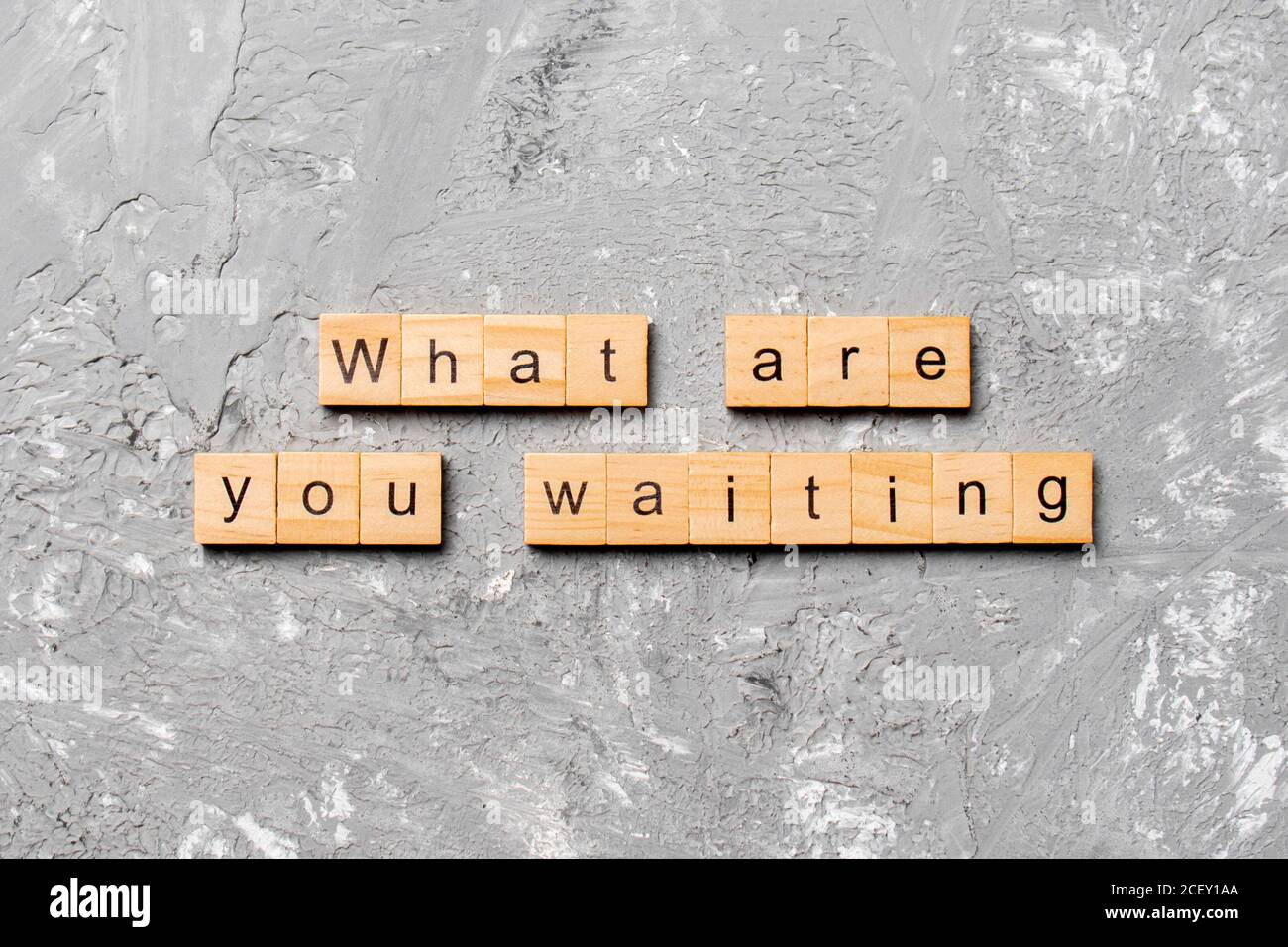 What are you waiting word written on wood block. What are you waiting ...