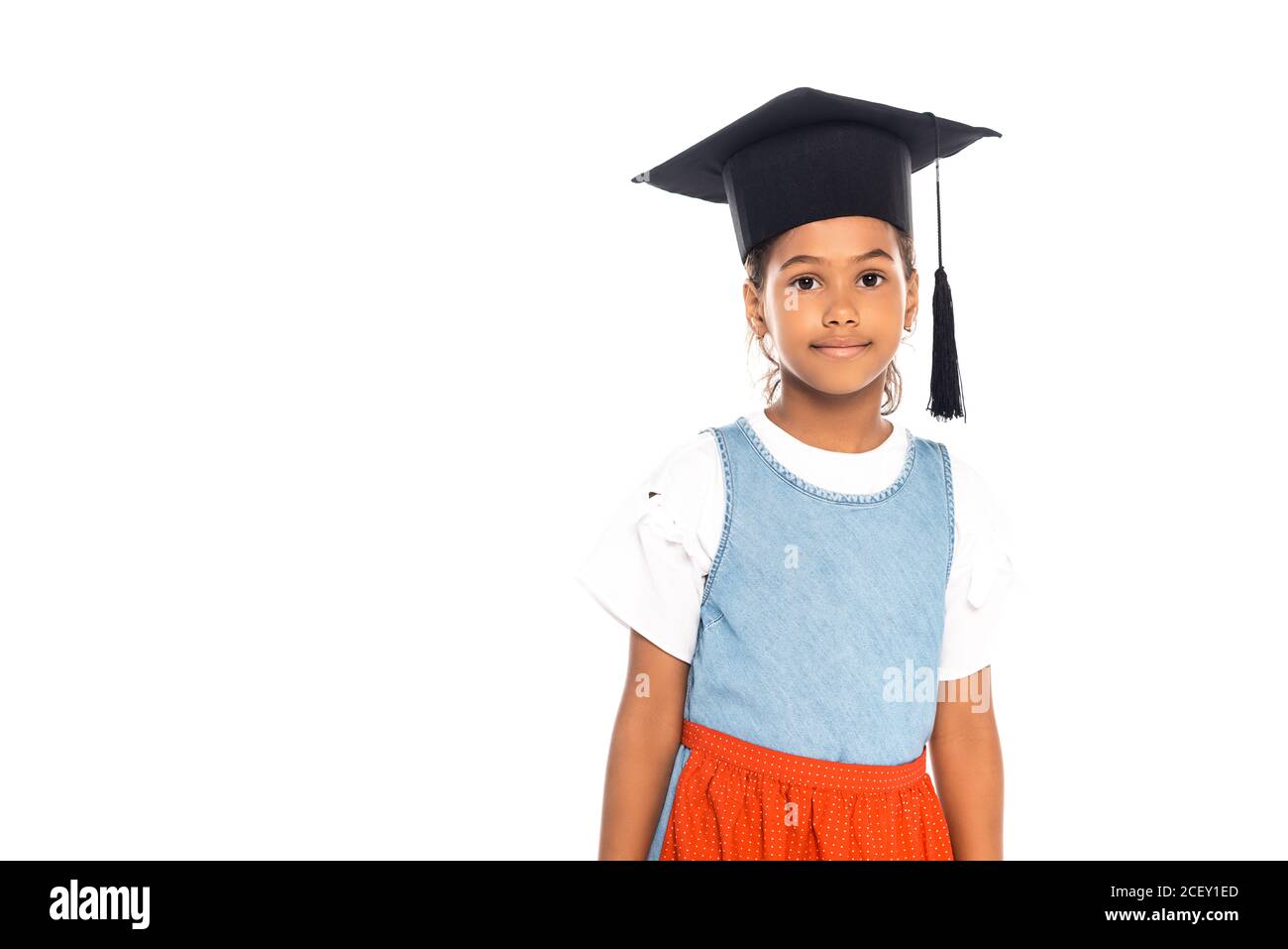 African american kid in graduation cap looking at camera isolated on ...