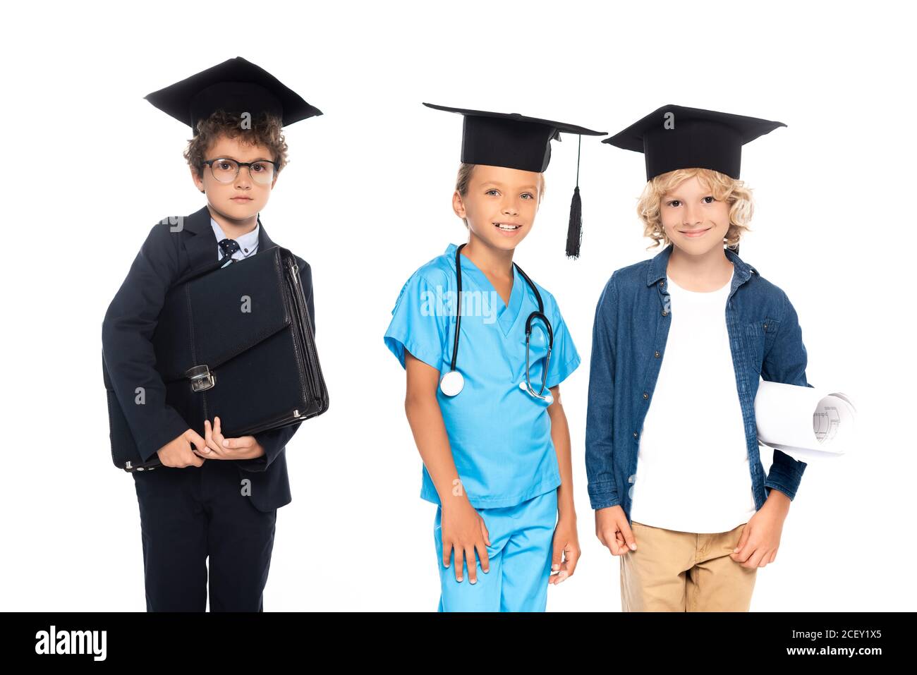 kids in graduation caps dressed in costumes of different professions ...