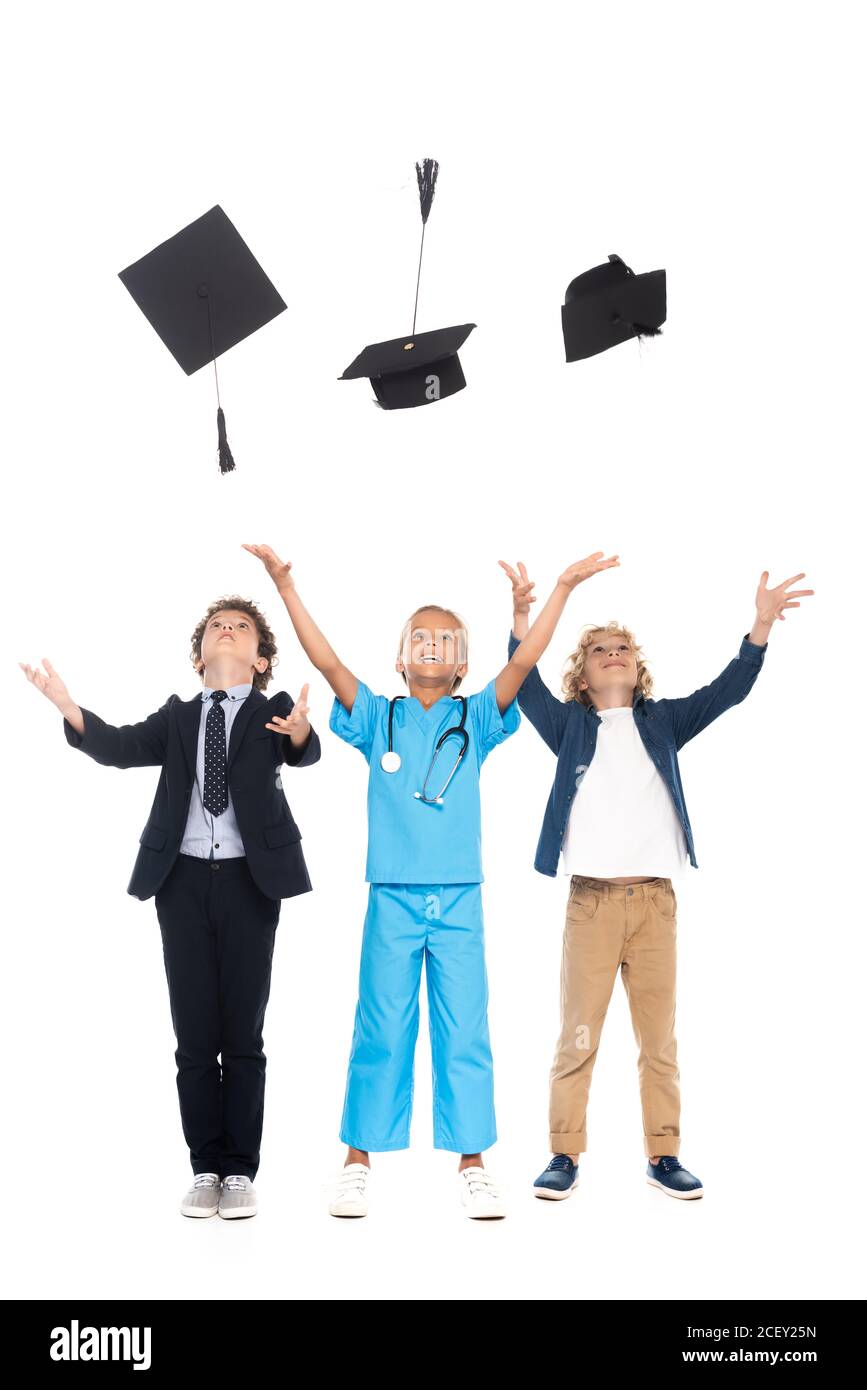 children dressed in costumes of different professions throwing in air ...