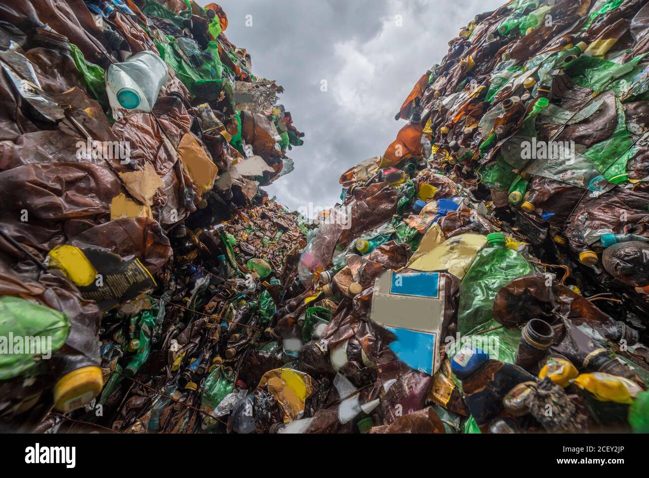 mountains of plastic bottles in a landfill for recycling. Waste ...