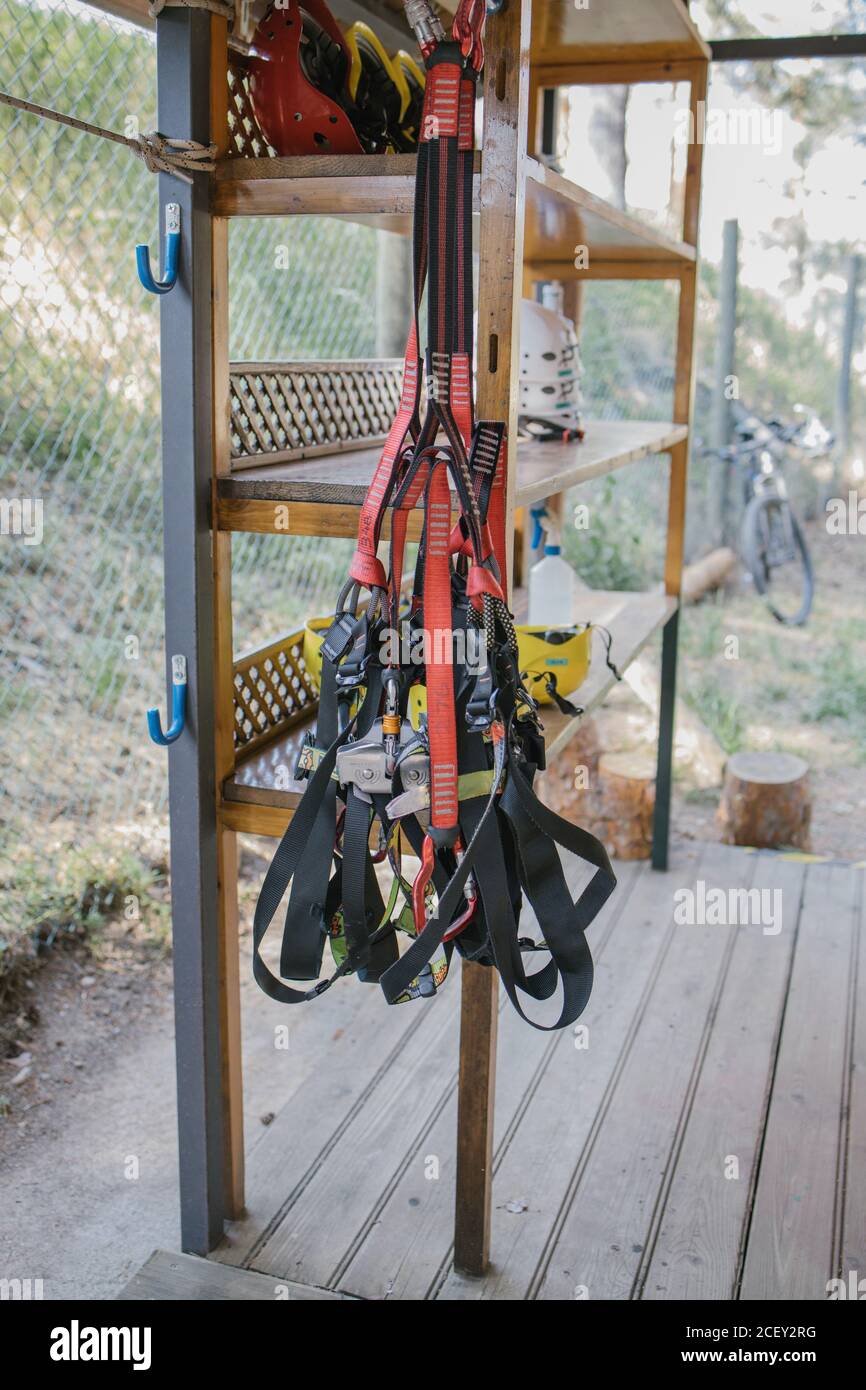 Collection of assorted safety equipment on wooden shelf in modern ...