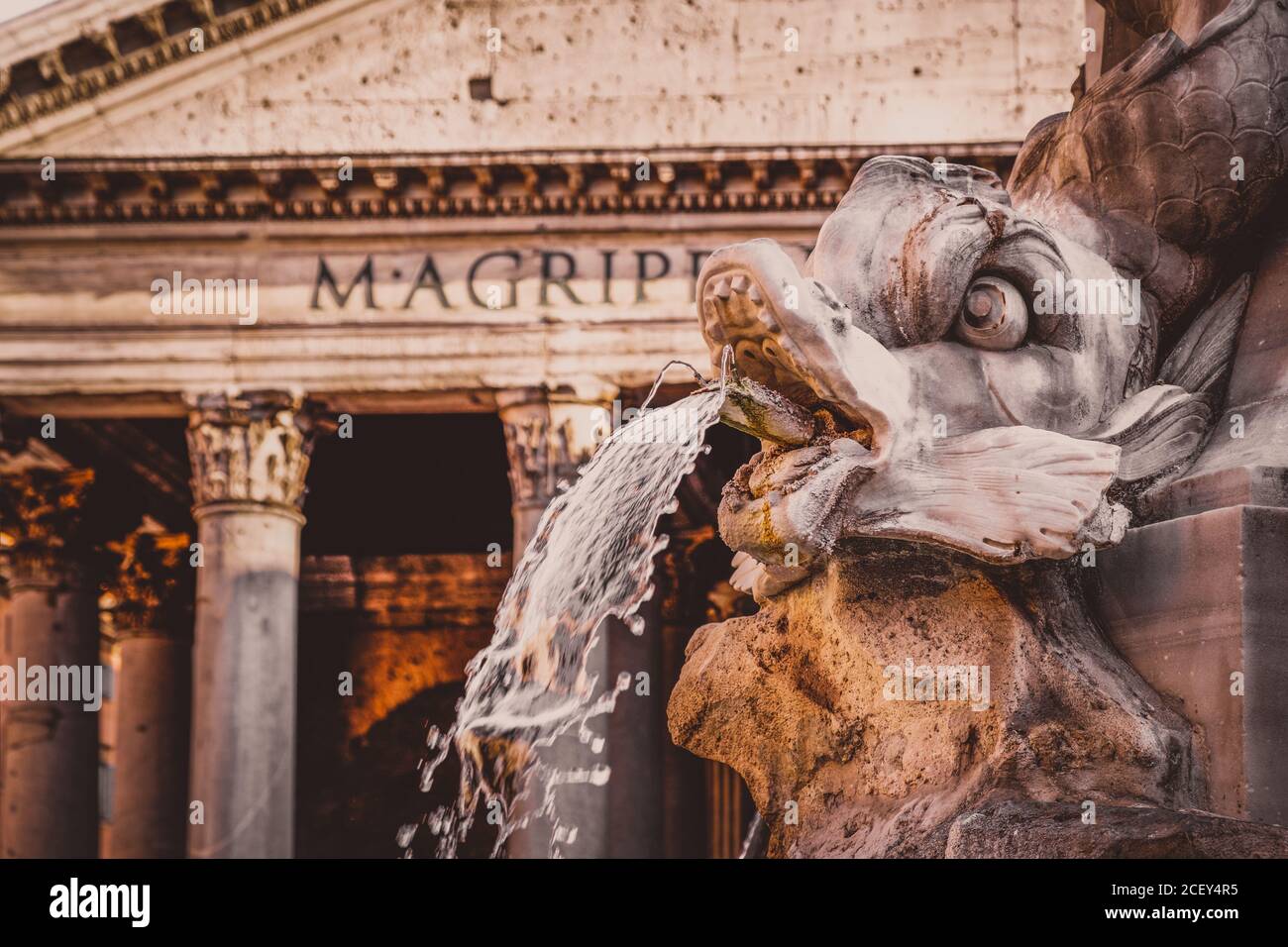 Old fountain and the Pantheon in central Rome illuminated at sunset ...