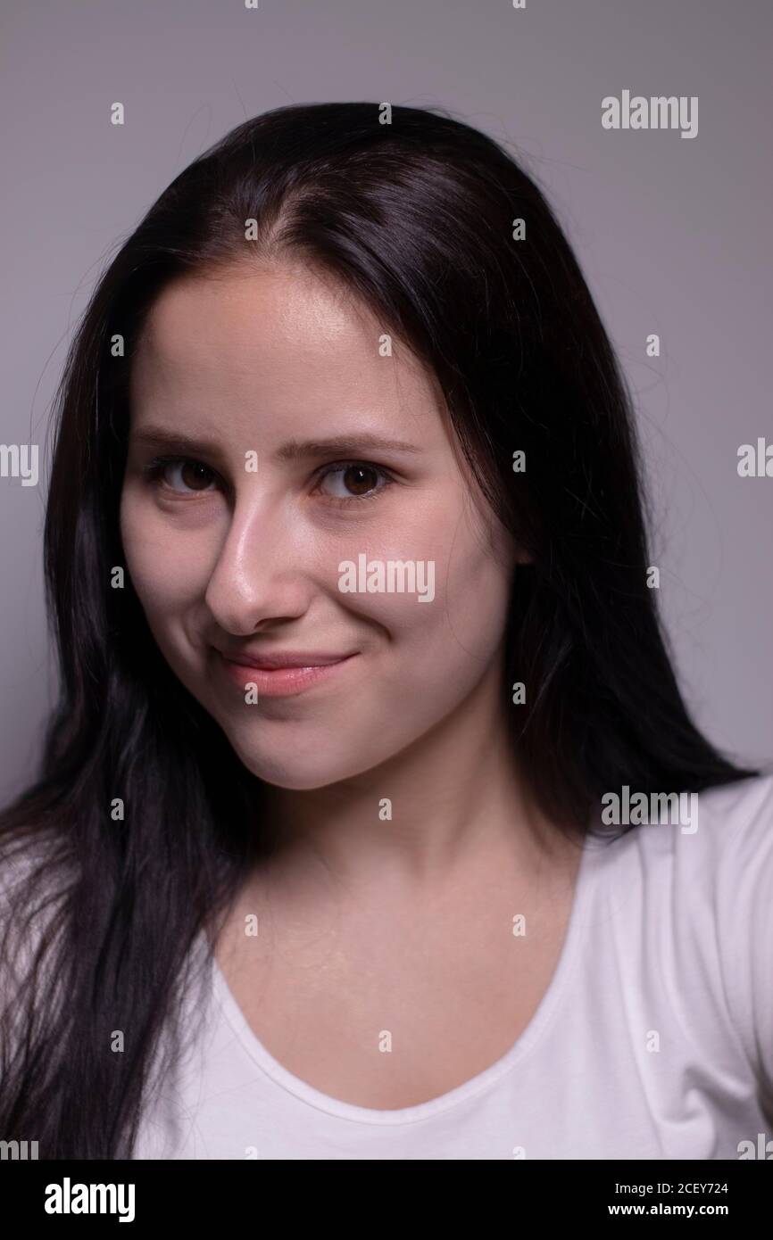Indoor portrait of Beautiful smiling brunette with clean skin, natural ...