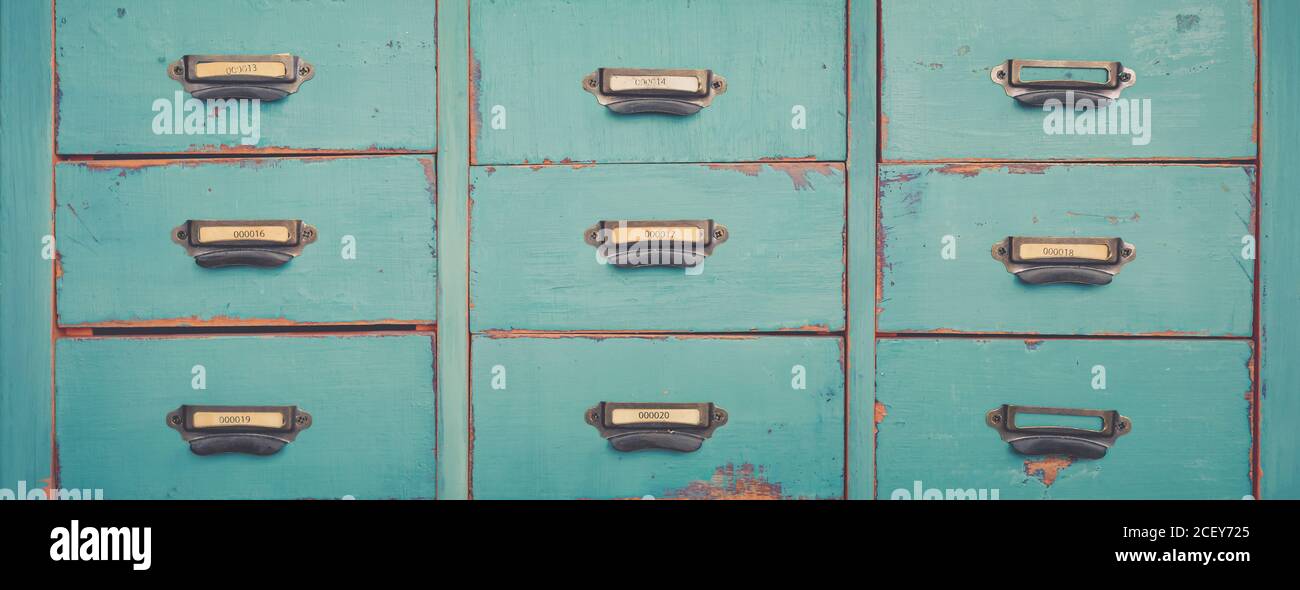 Old turquoise and brown colored wooden file and document cabinet with ...