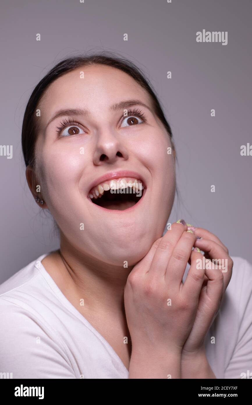 Indoor portrait of Beautiful smiling brunette with clean skin, natural ...