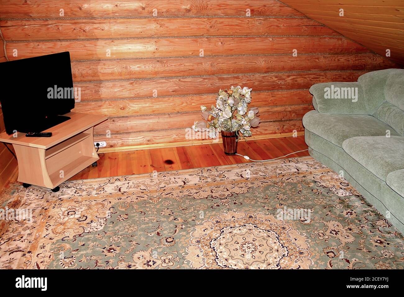 simple interior in country style in a wooden house. Lounge room with ...