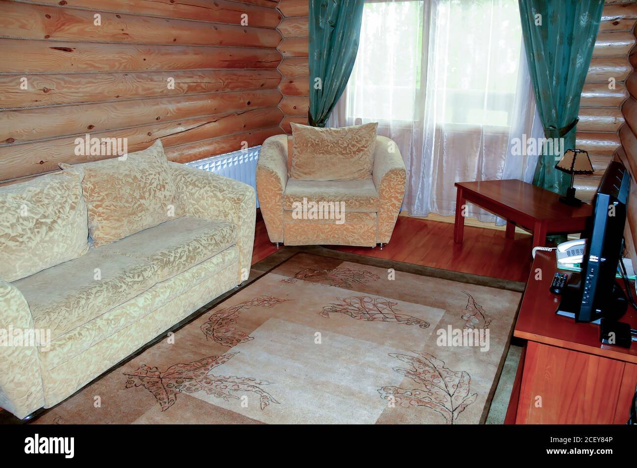 simple interior in country style in a wooden house. Lounge room with ...