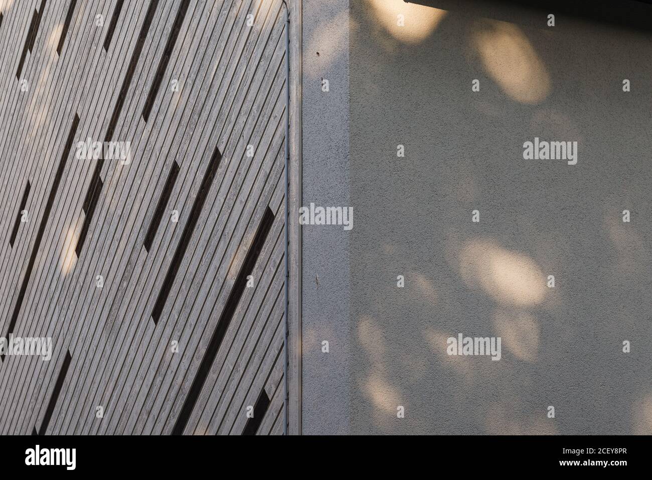 Grey cast concrete walls with covering by wooden patterns. Grey color ...