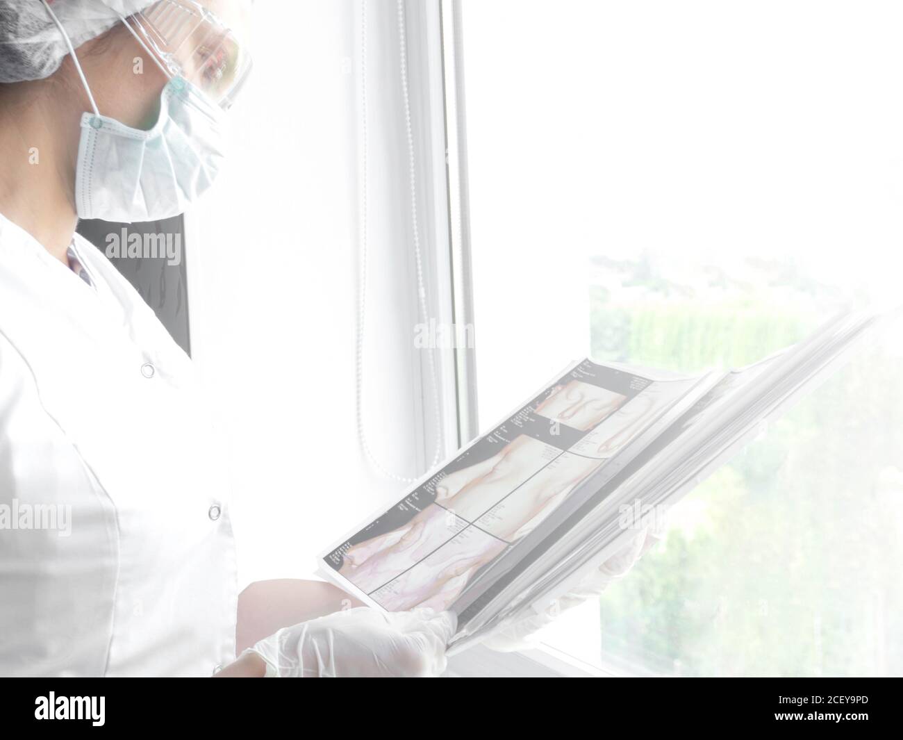 medical doctor watching a patient x-ray in hospital, tomography ...