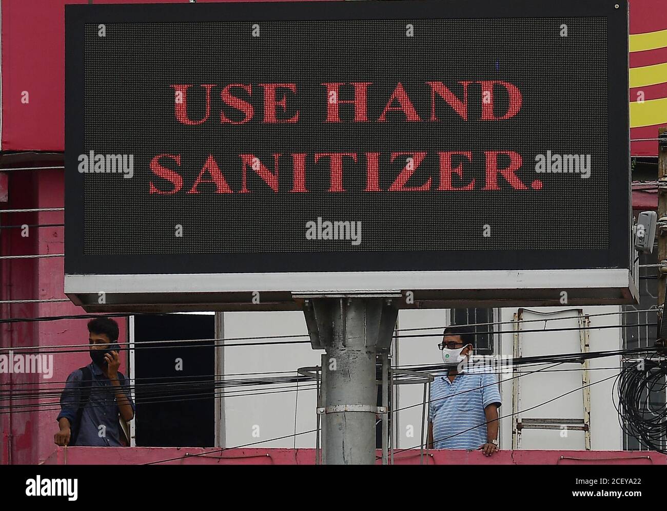 A digital sign board with different messages on safety measures ...