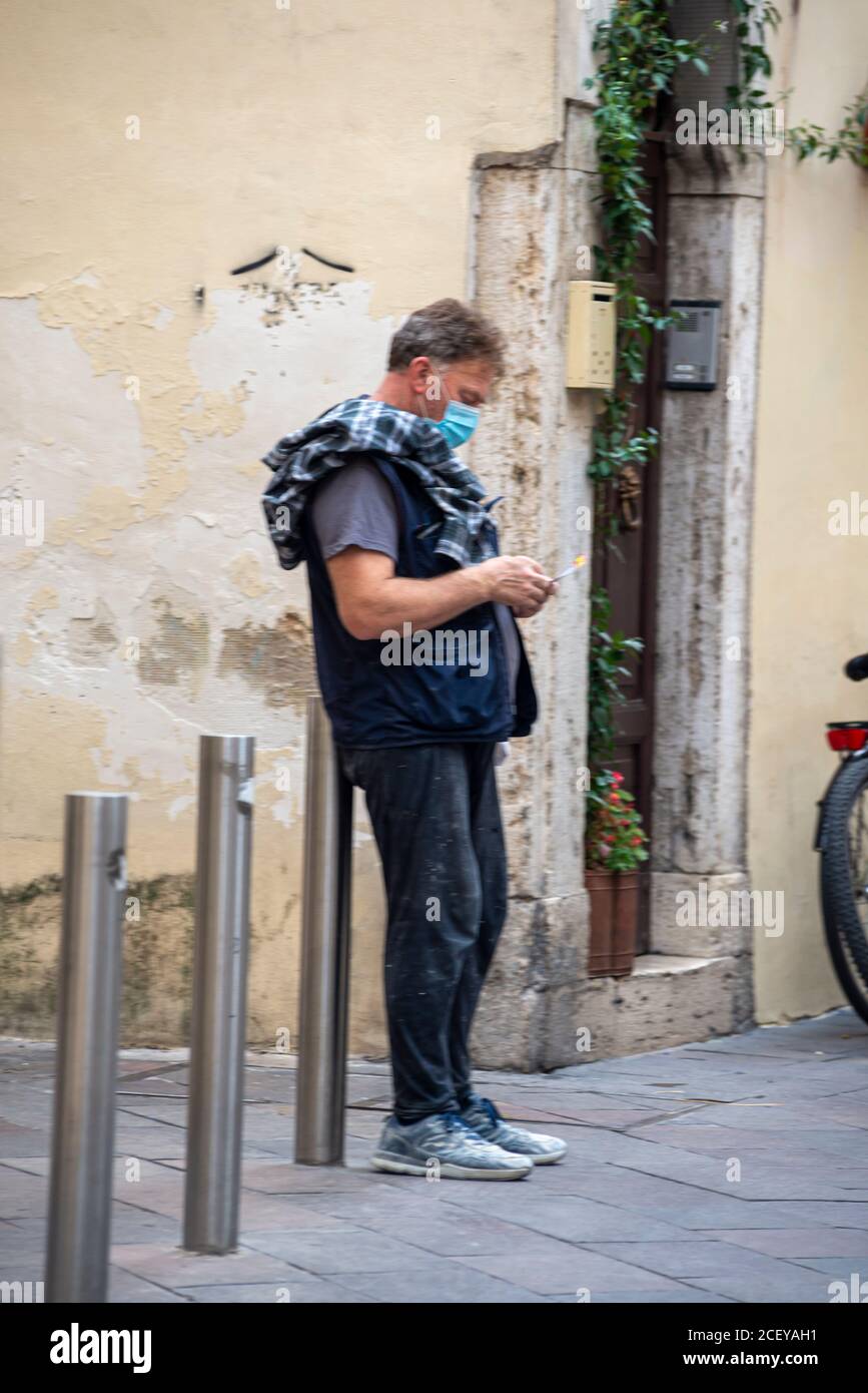 terni,italy september 02 2020:man scratching a scratch card with ...