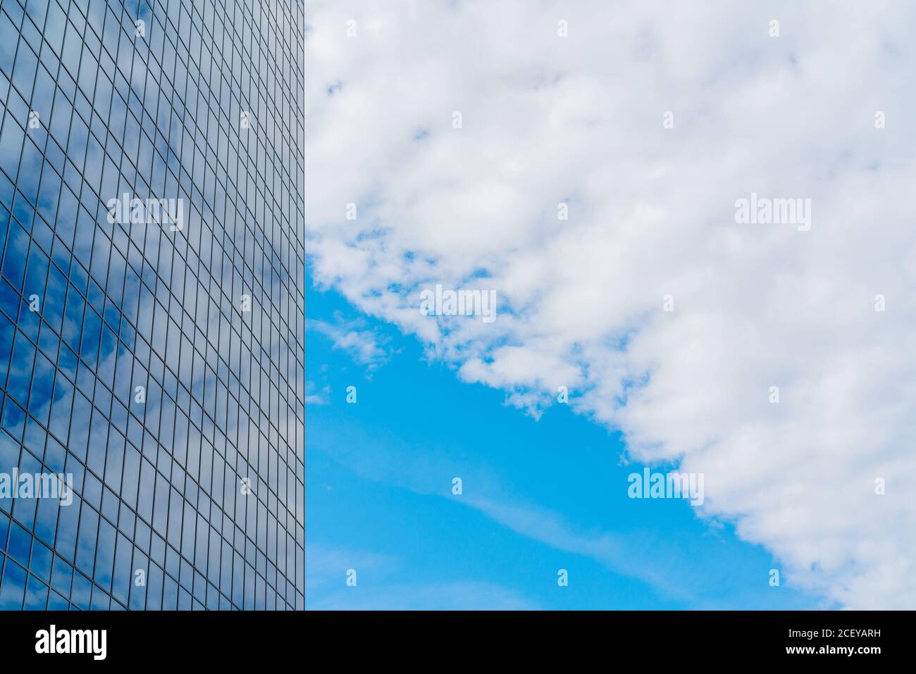 High-rise glass building against the blue sky. Modern architecture ...