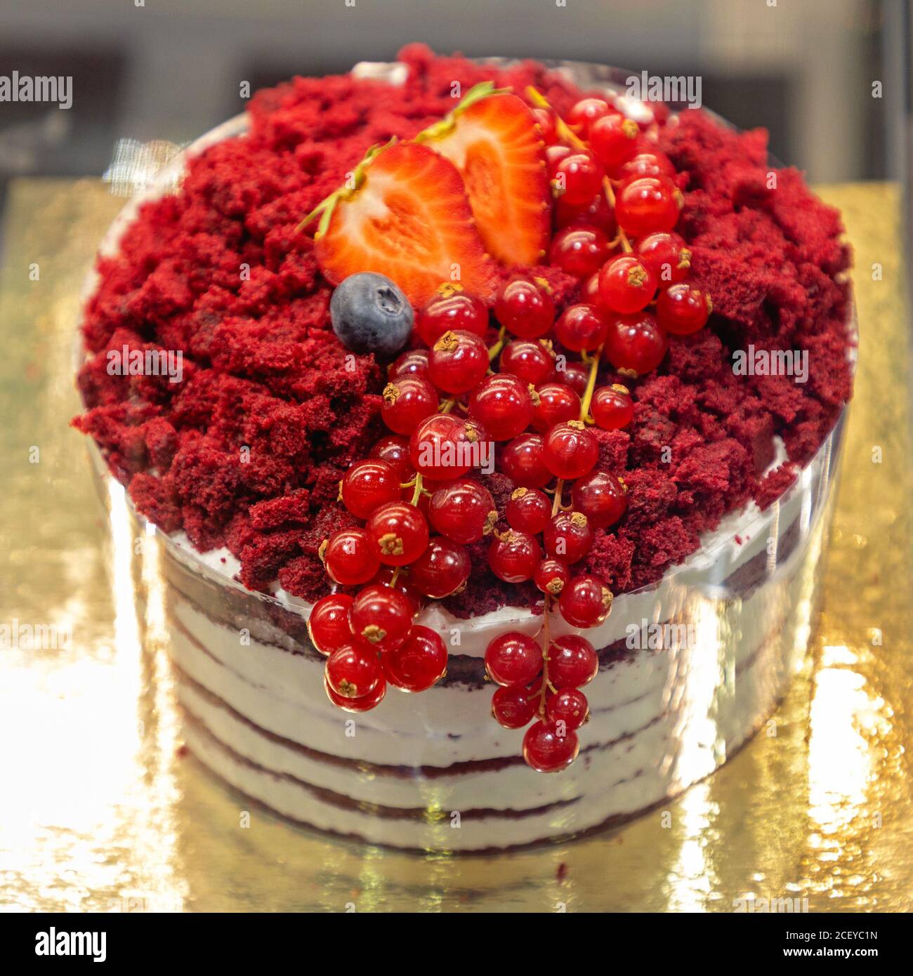 One Big Mix Red Berry Cake in Patisserie Stock Photo - Alamy