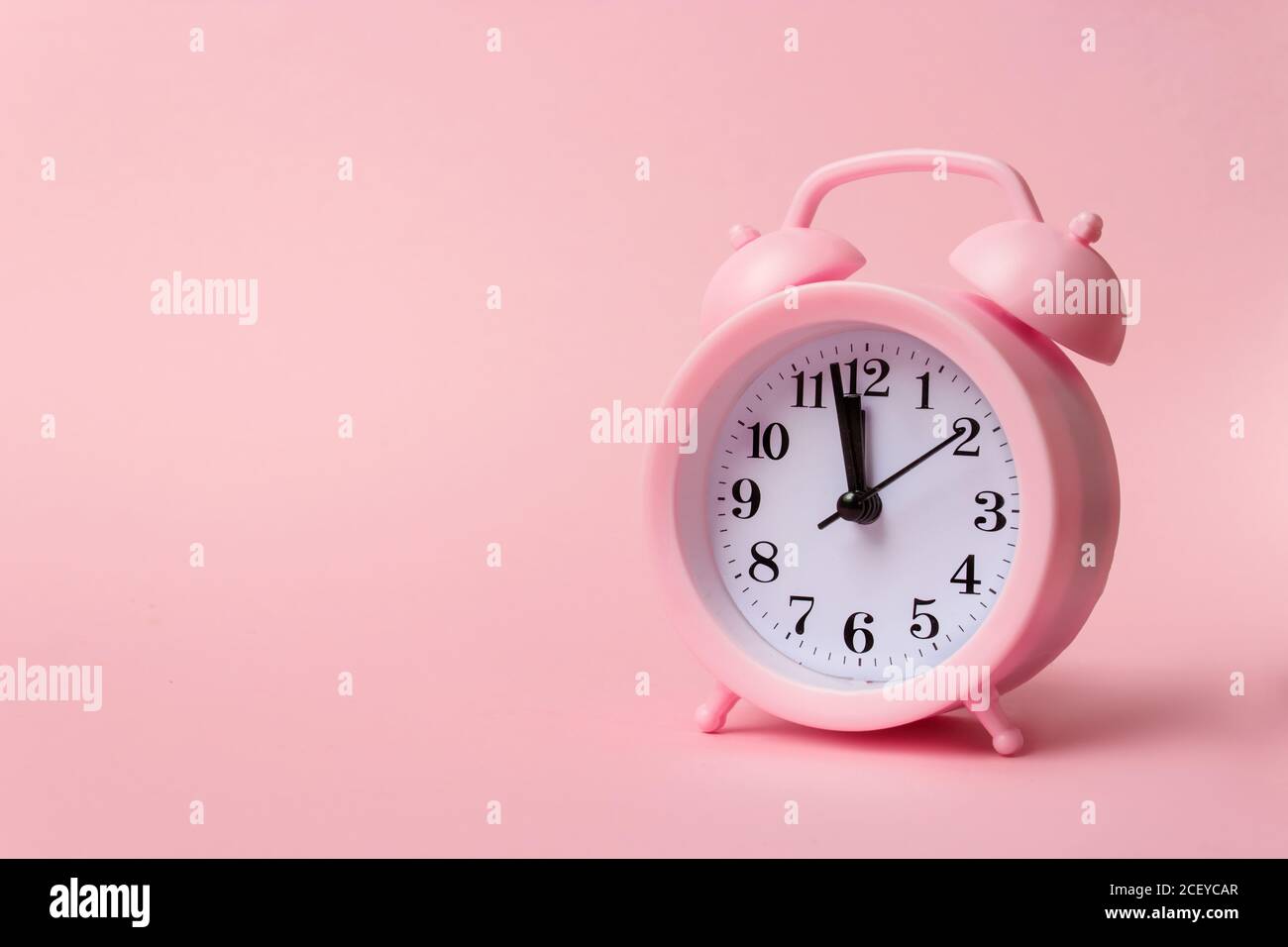 Pink alarm clock. Time is money mockup. Time-limit. Business deadline ...