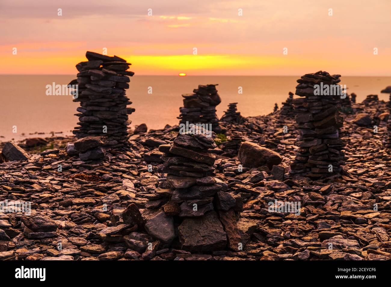 Beautiful stone pyramid built from pieces of rocky shore of Baltic sea ...