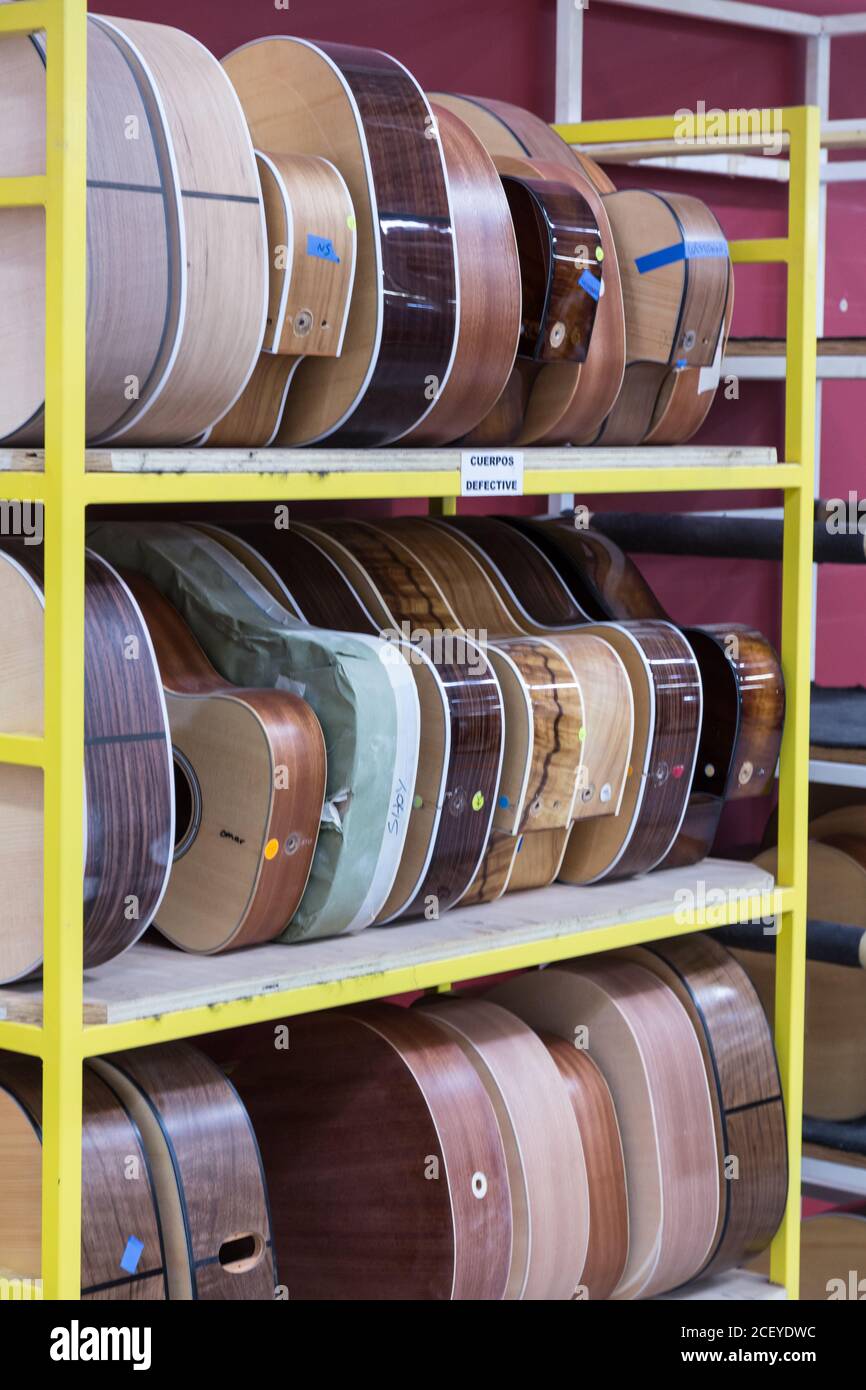 Partially finished guitar bodies in the assembly line at the Taylor ...