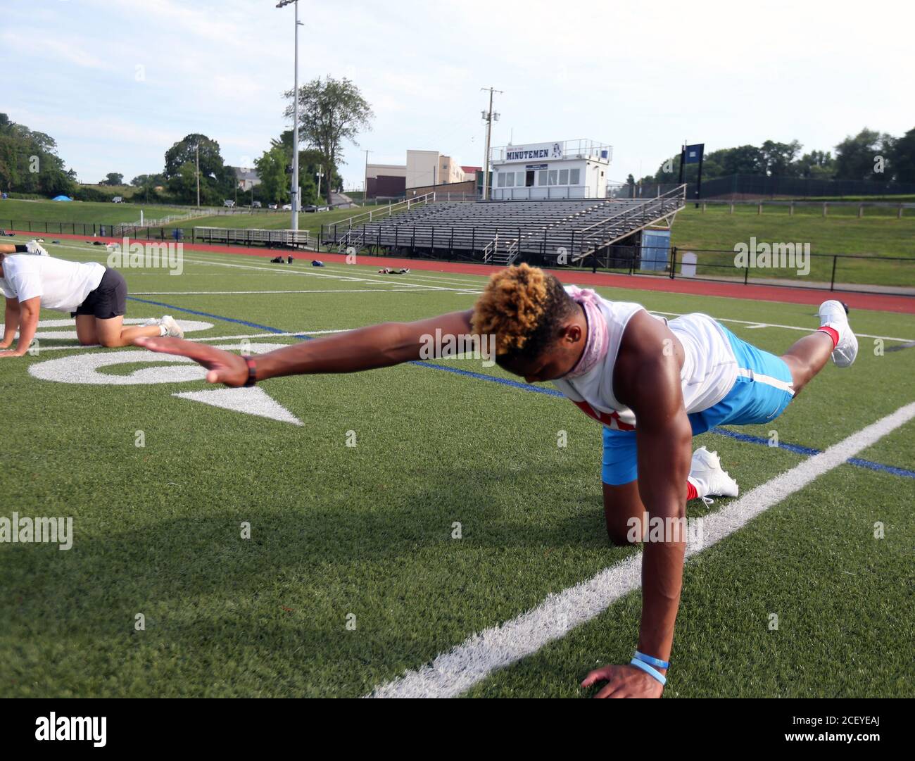 High school students exercising on a football field Stock Photo - Alamy