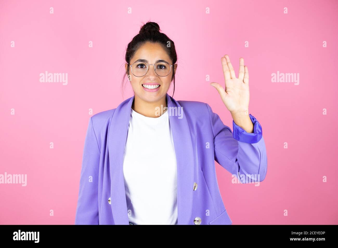 Young beautiful business woman over isolated pink background doing star ...