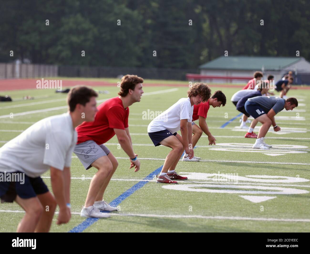 High school students exercising on a football field Stock Photo - Alamy