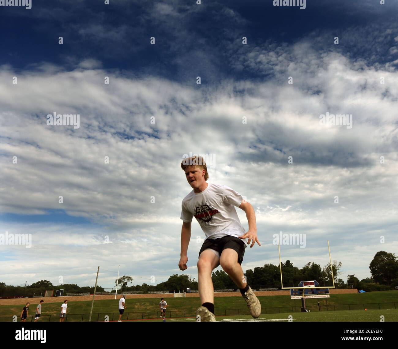 High school students exercising on a football field Stock Photo - Alamy