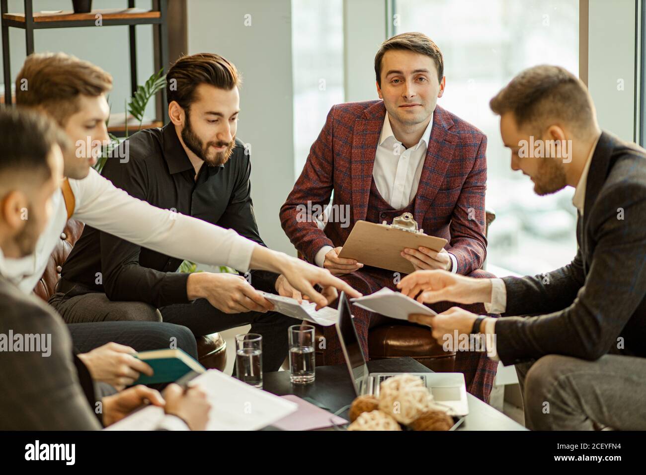 successful meeting of business crew consisted of young men leaders in ...
