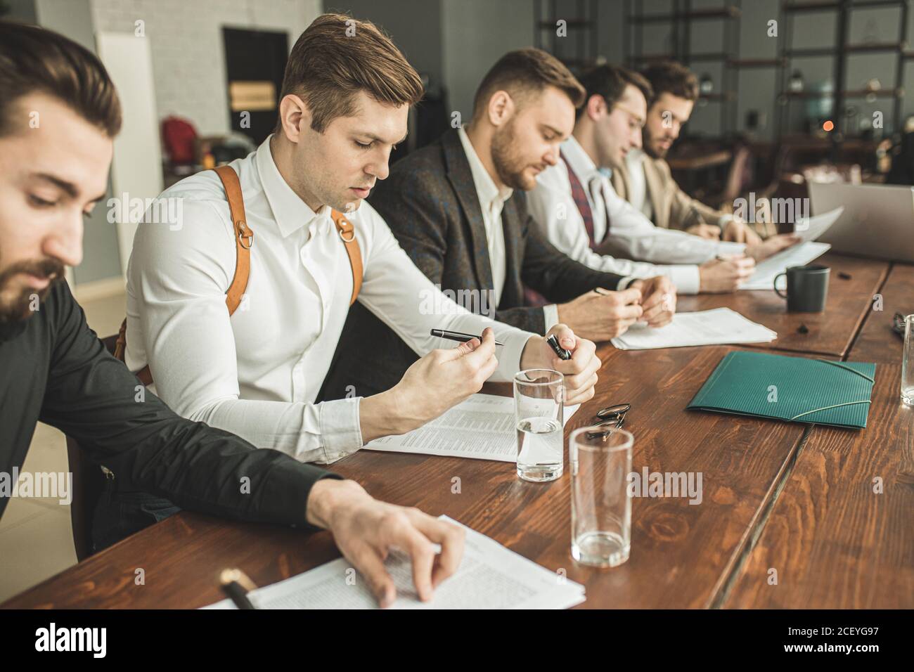 coworking of handsome guys in tuxedo, isolated in modern office ...