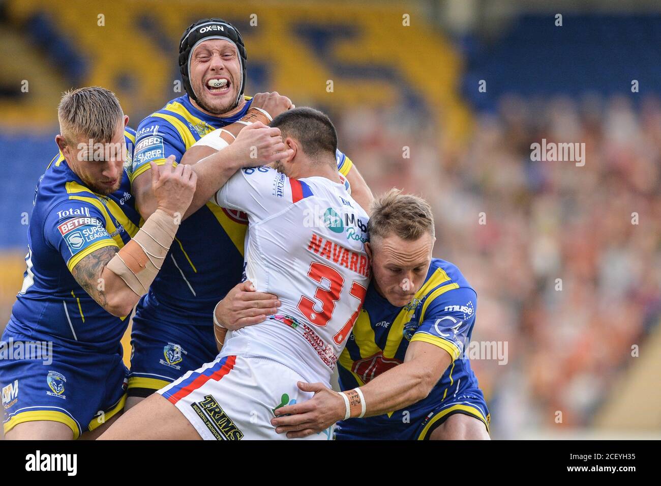 Wakefield Trinity's Romain Navarrete is stopped by Ben Currie, Chris ...
