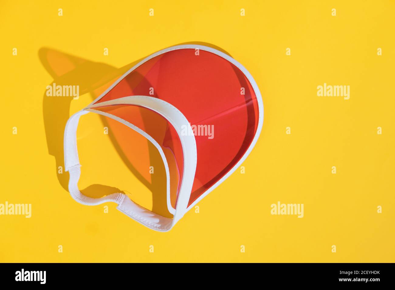 Summer bright flatlay on colorful background with tubes and bottle with ...