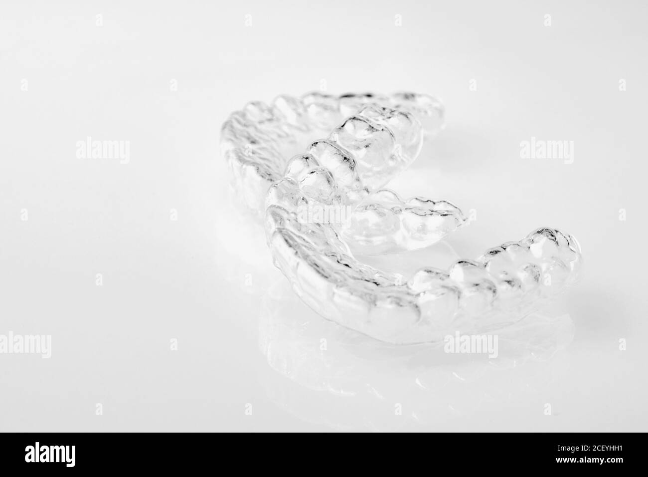 Two Invisible dental teeth aligners on the white background ...