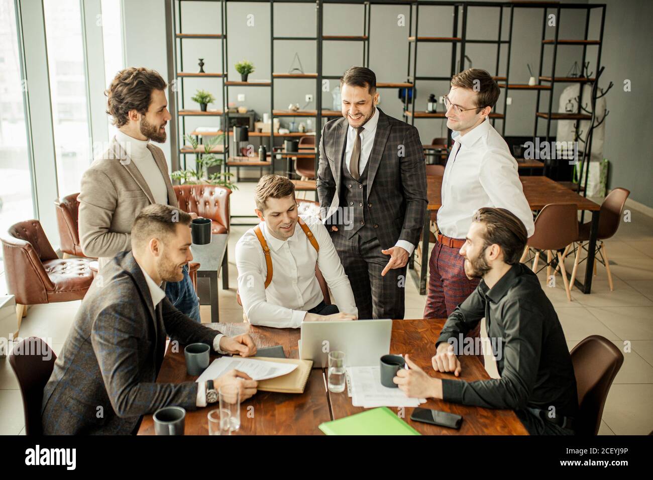 teamwork of young caucasian bearded leaders in modern office ...