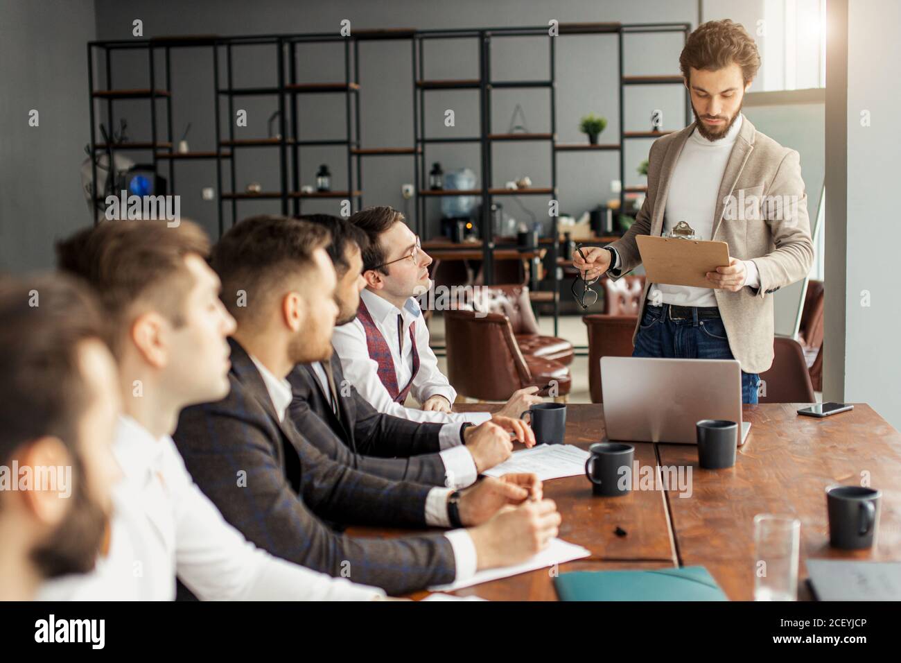 young caucasian business partners, handsome enthusiastic guys in tuxedo ...