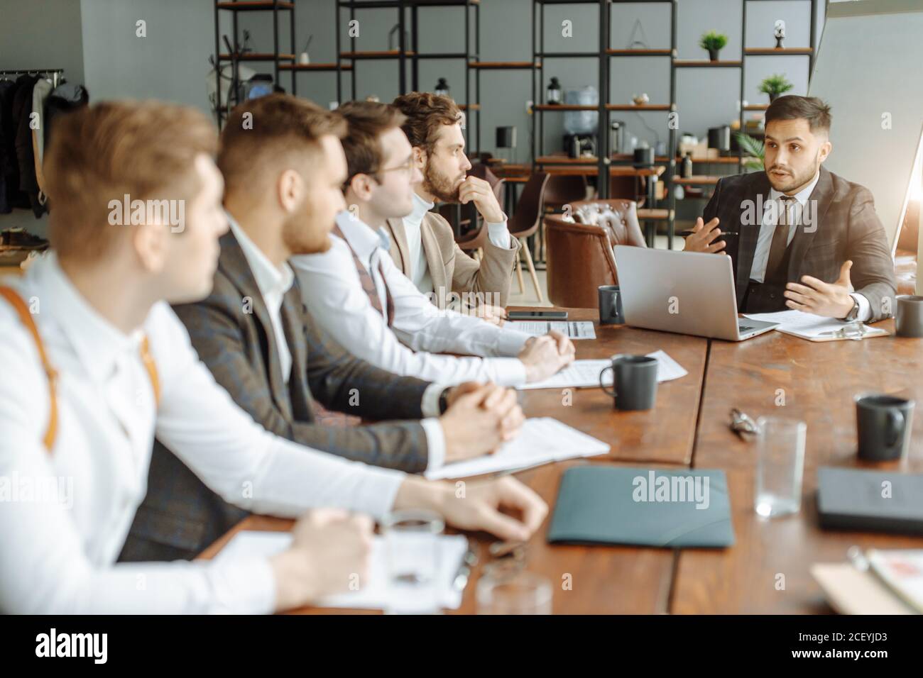 Men only meeting table suits hi-res stock photography and images - Alamy
