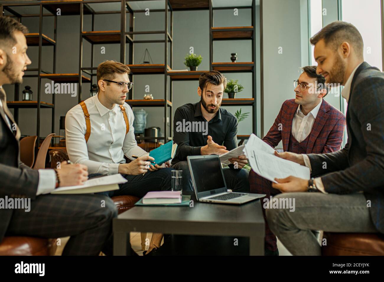 coworking of handsome guys in tuxedo, isolated in modern office ...