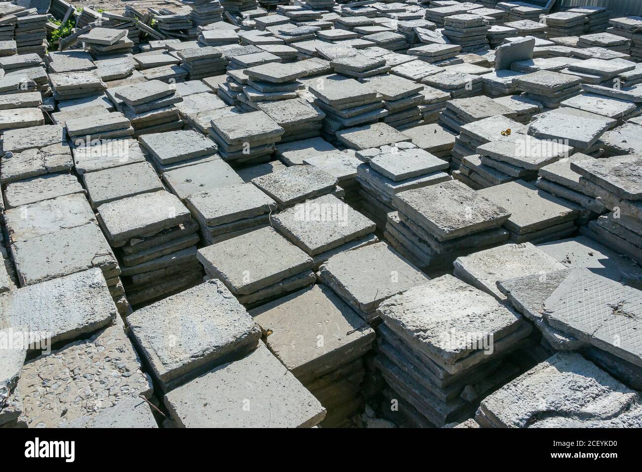 Old paving slabs stacked. Repair work on the road. Reconstruction of ...