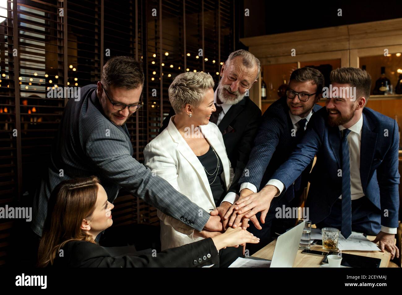 Smiling multiethnic people finishing support hi-res stock photography ...