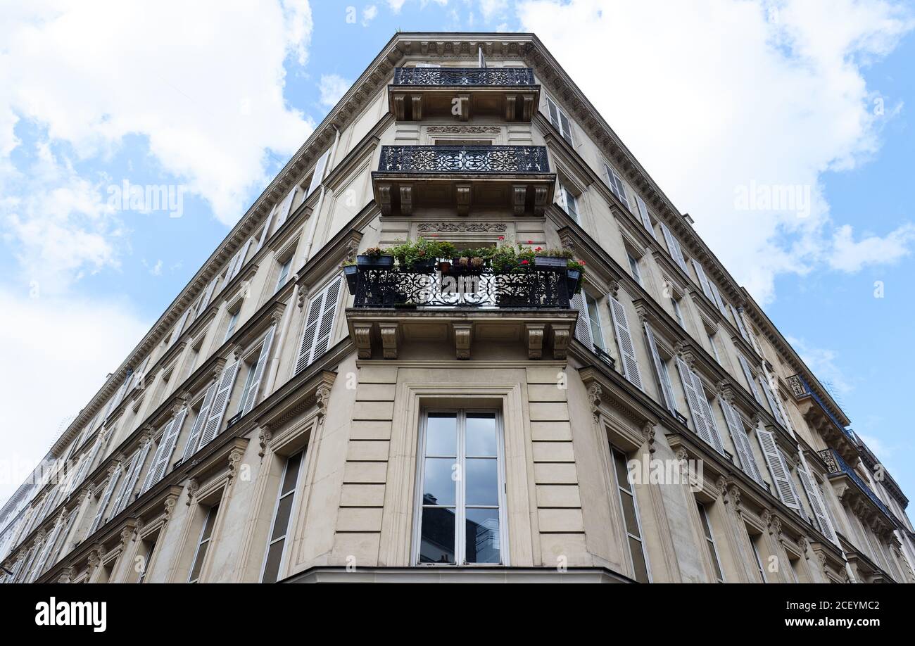 Traditional French house with typical balconies and windows. Paris ...