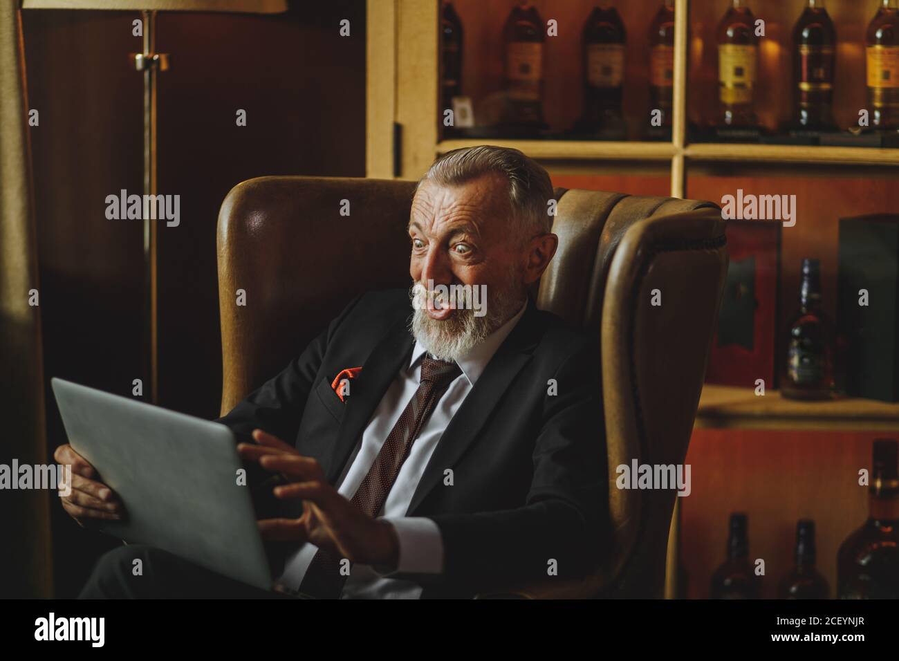 Shocked alarmed elderly man with evel eye, keeps mouth opened, stares ...