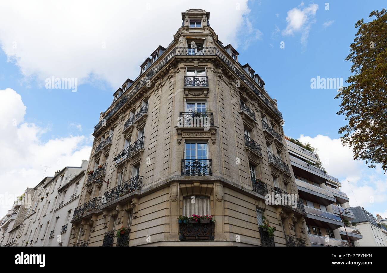 Traditional French house with typical balconies and windows. Paris ...