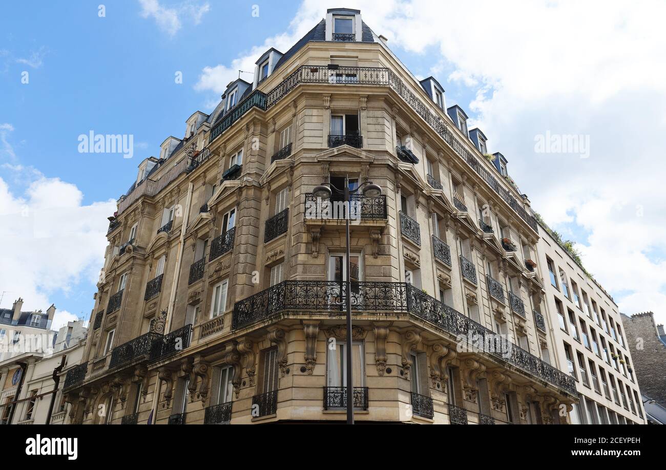 Traditional French house with typical balconies and windows. Paris ...
