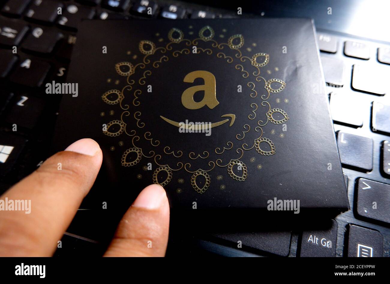 In this photo illustration an AMAZON Logo seen displayed on an Amazon ...