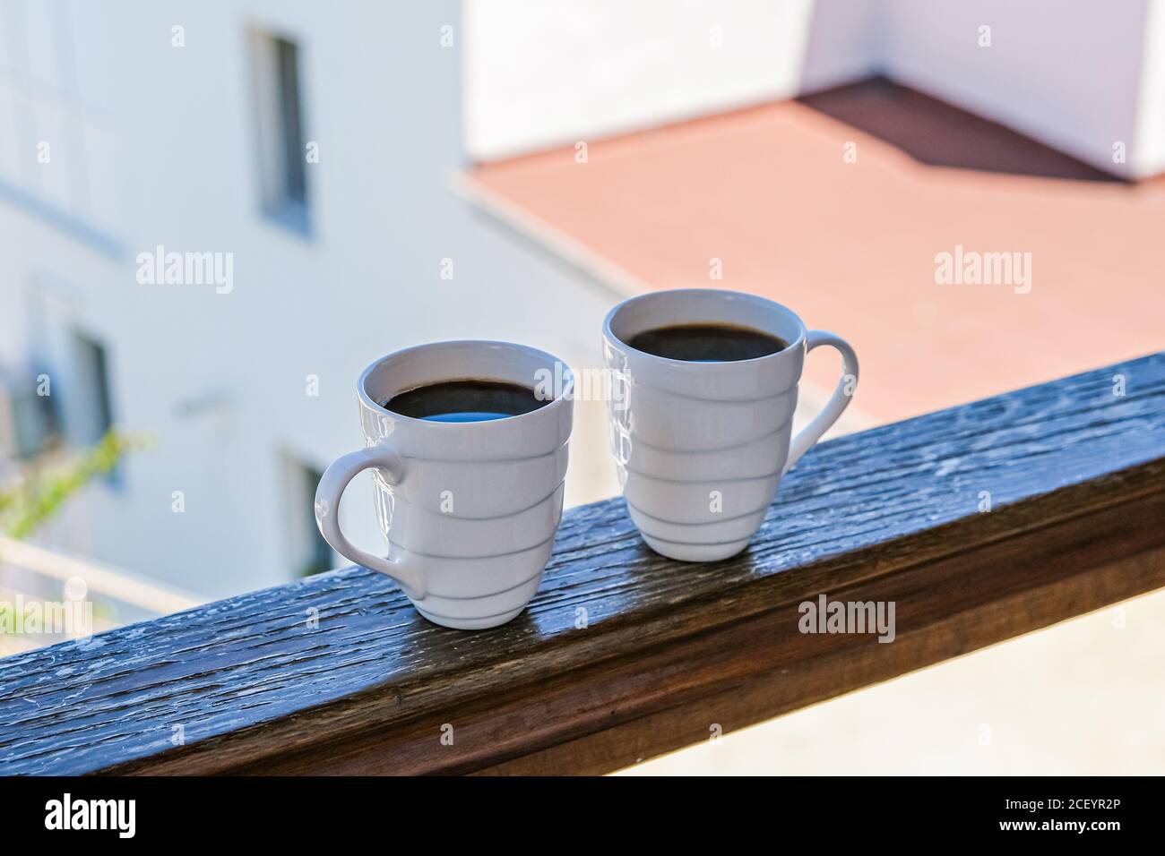 two coffee cup coffee cups in wooden balcony terrace Stock Photo - Alamy