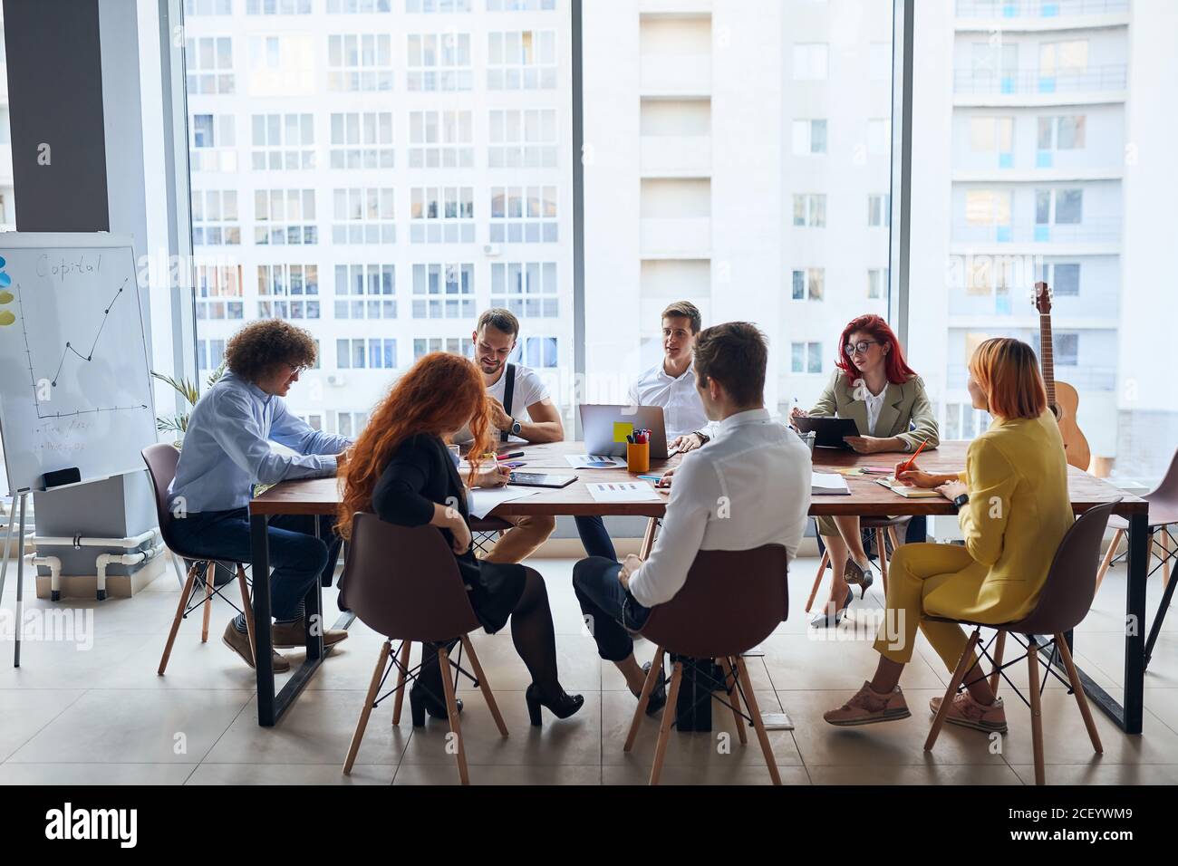 Co-workers women and men together working on project, proffesional ...